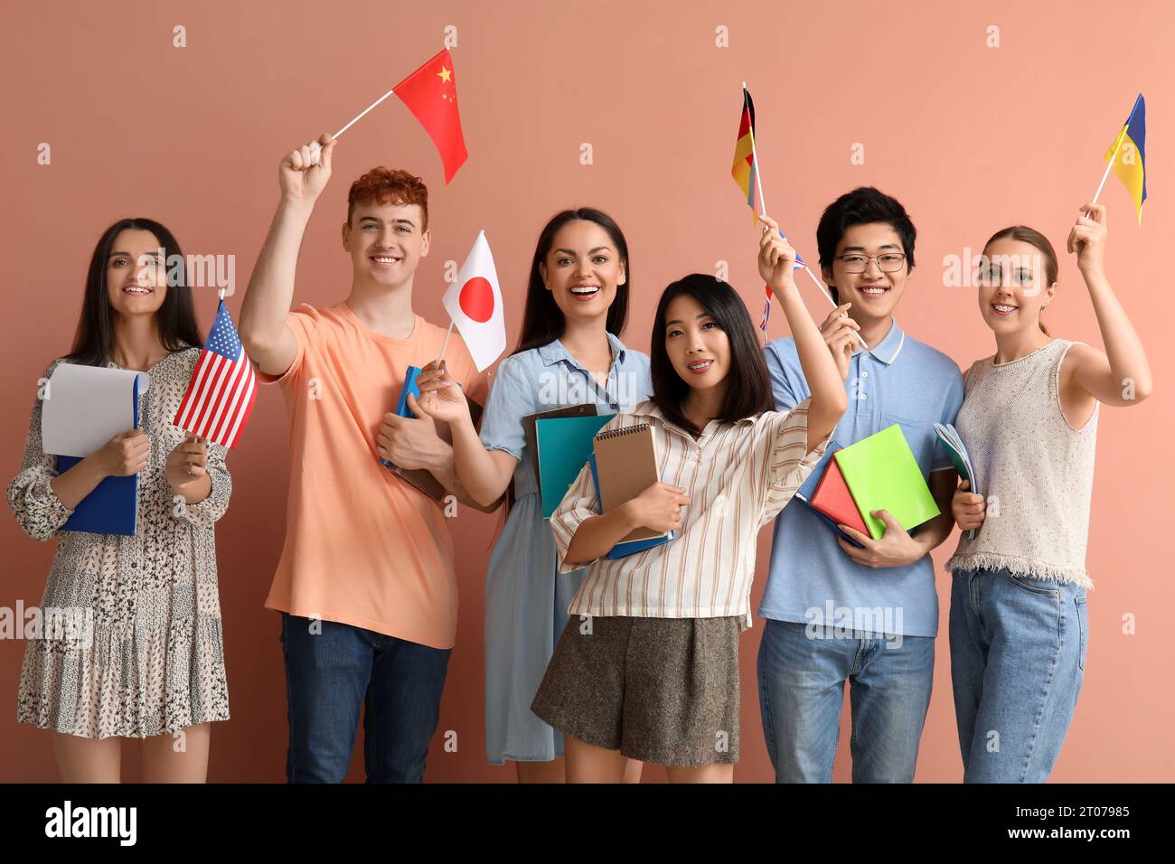 Young students of language school with flags on pink background Stock ...