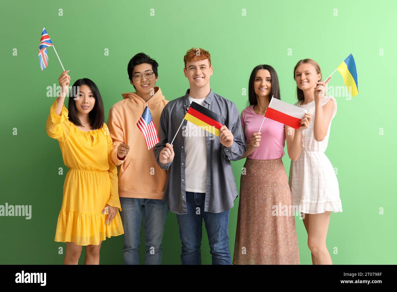 Young students of language school with flags on green background Stock ...
