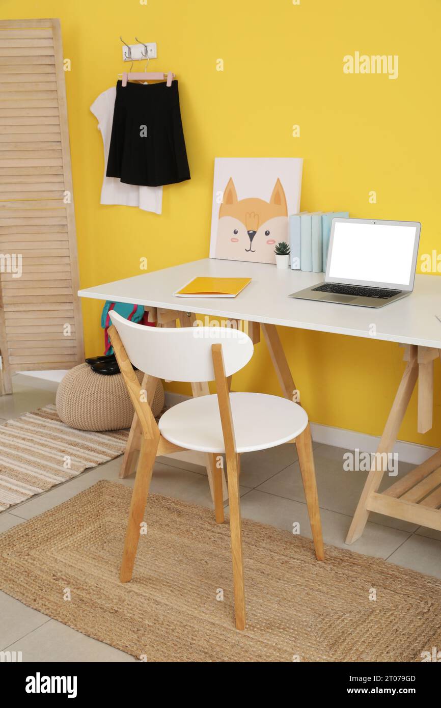 Interior of modern room with workplace and stylish school uniform Stock ...
