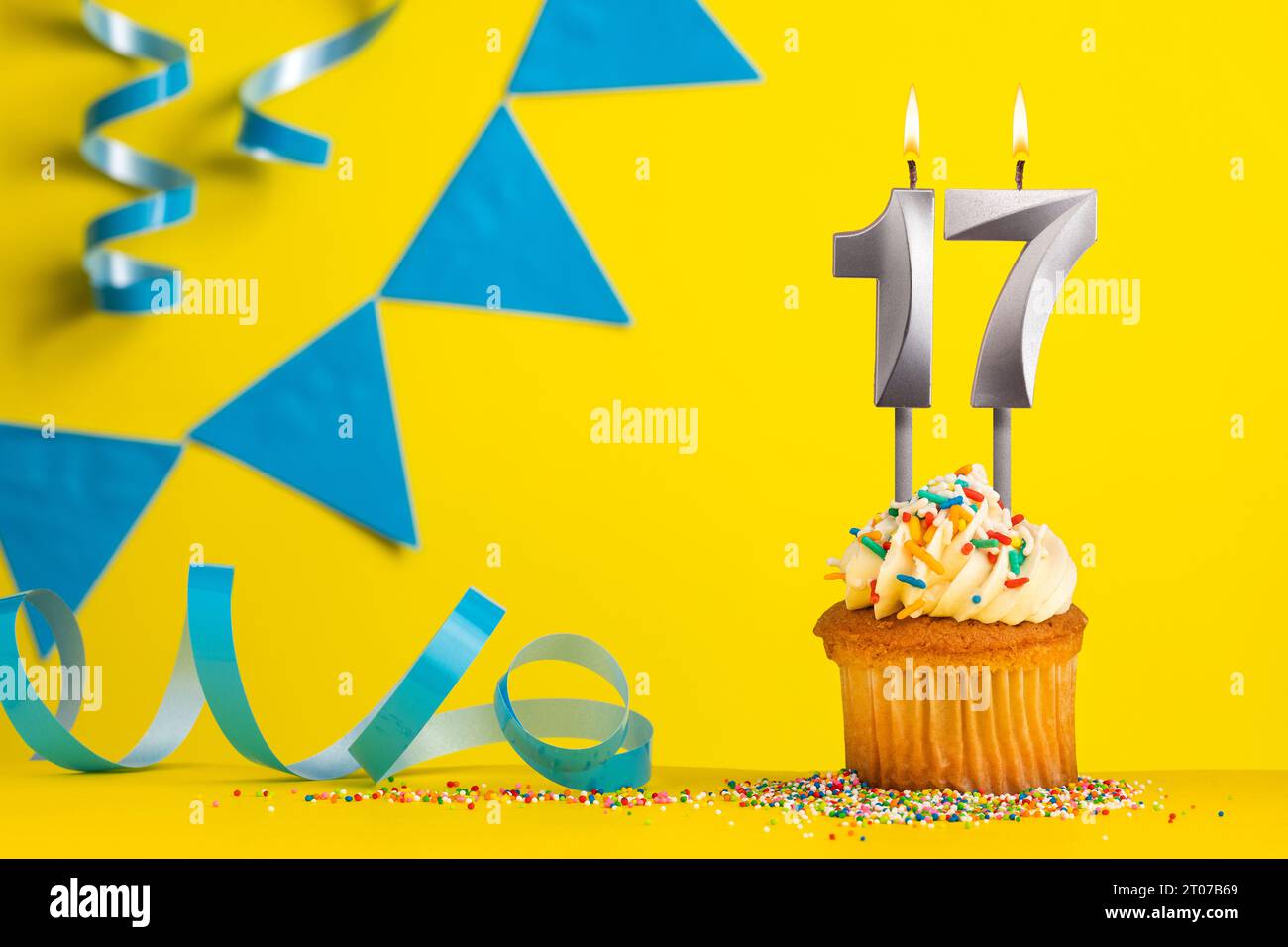 Birthday candle number 17 with cupcake - Yellow background with blue ...