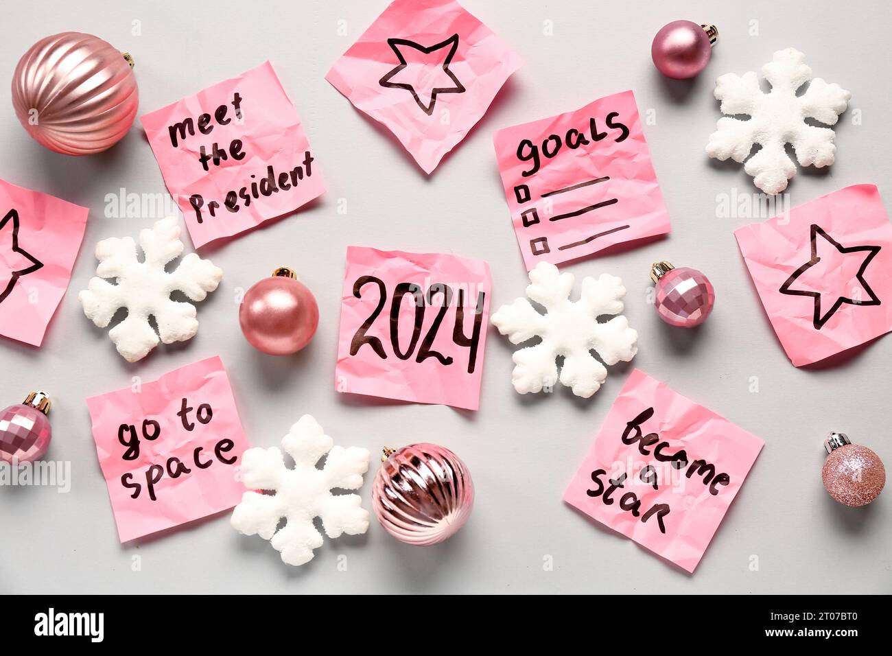 Sticky notes with different goals for 2024 and Christmas decorations on ...