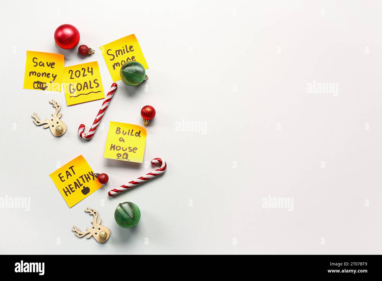 Sticky notes with different goals for 2024 and Christmas decorations on ...
