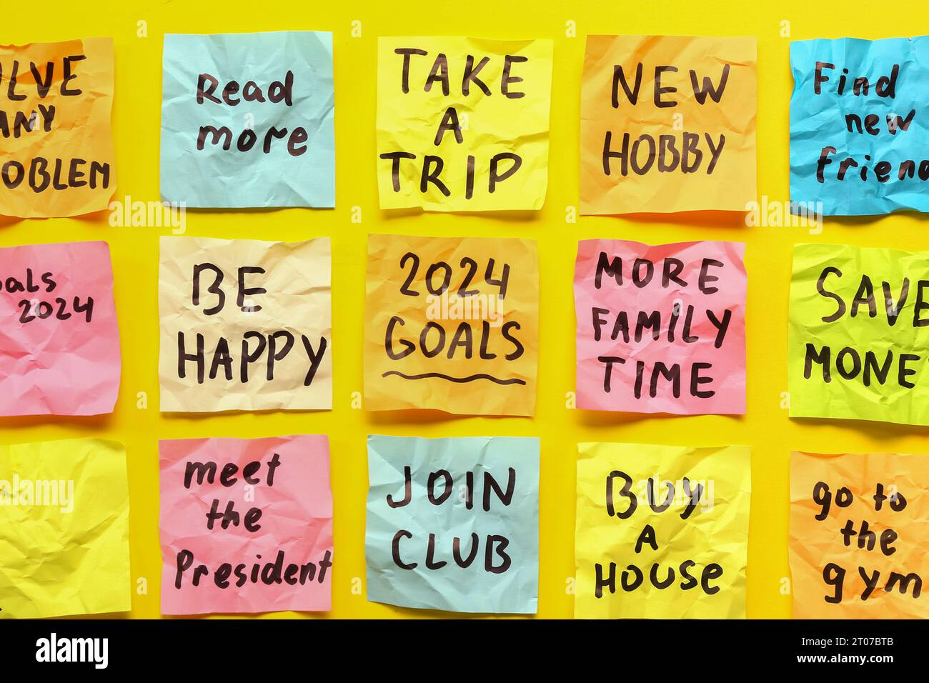 Sticky notes with different goals for 2024 on yellow background Stock ...