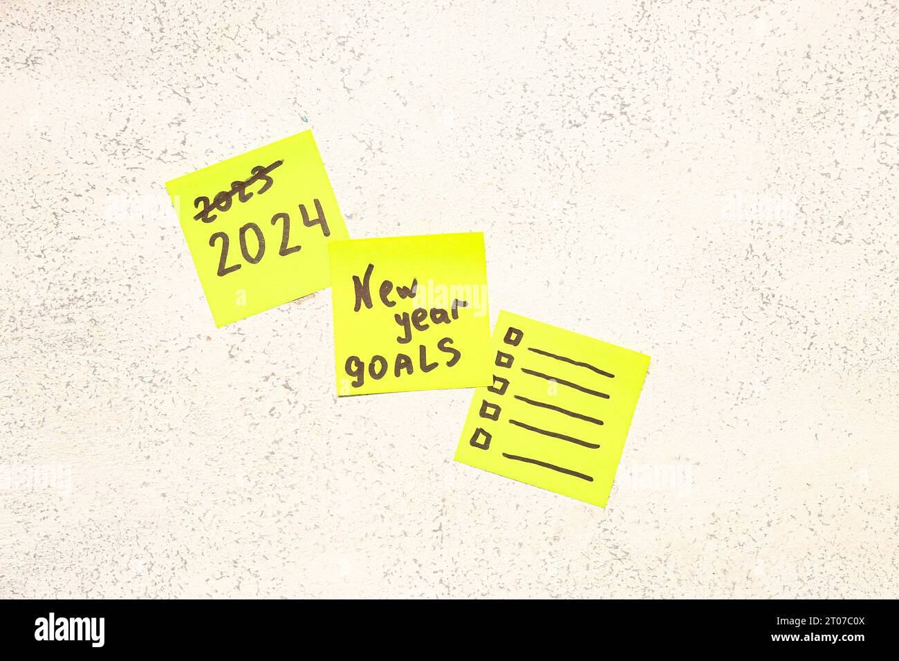 Sticky notes with different goals for 2024 on grunge white background ...