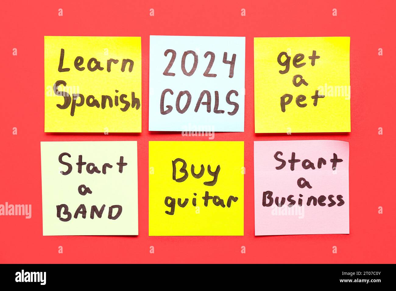 Sticky notes with different goals for 2024 on red background Stock ...