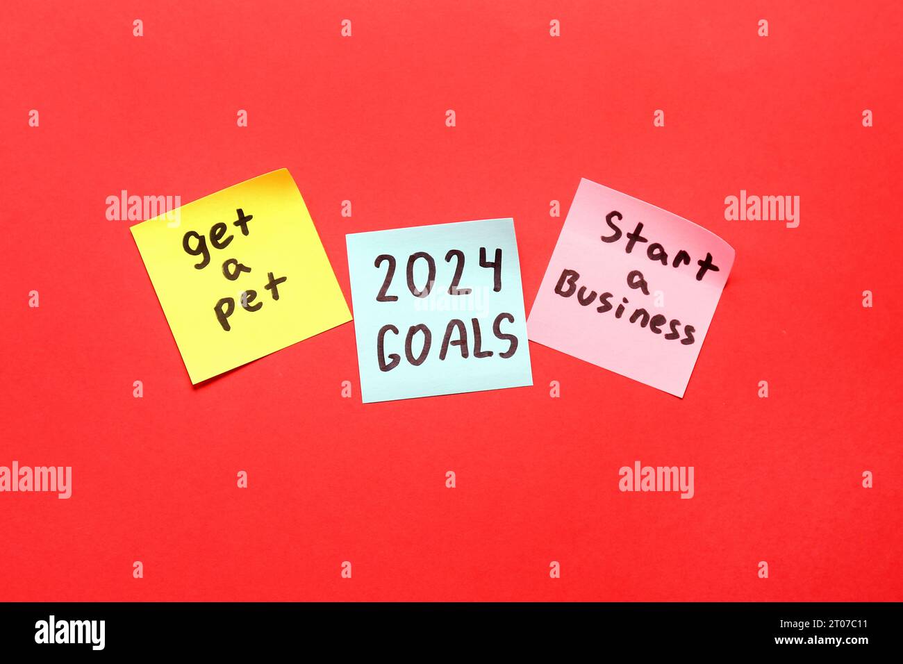 Sticky notes with different goals for 2024 on red background Stock ...