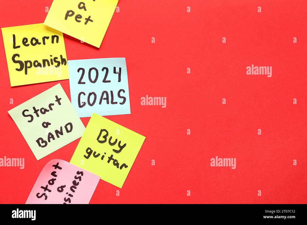 Sticky notes with different goals for 2024 on red background Stock ...