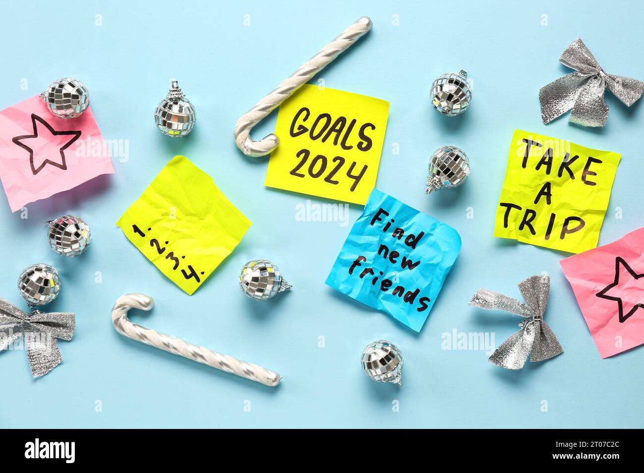 Sticky notes with different goals for 2024 and Christmas decorations on ...