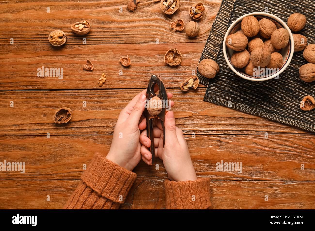 Woman cracking nuts hi-res stock photography and images - Alamy
