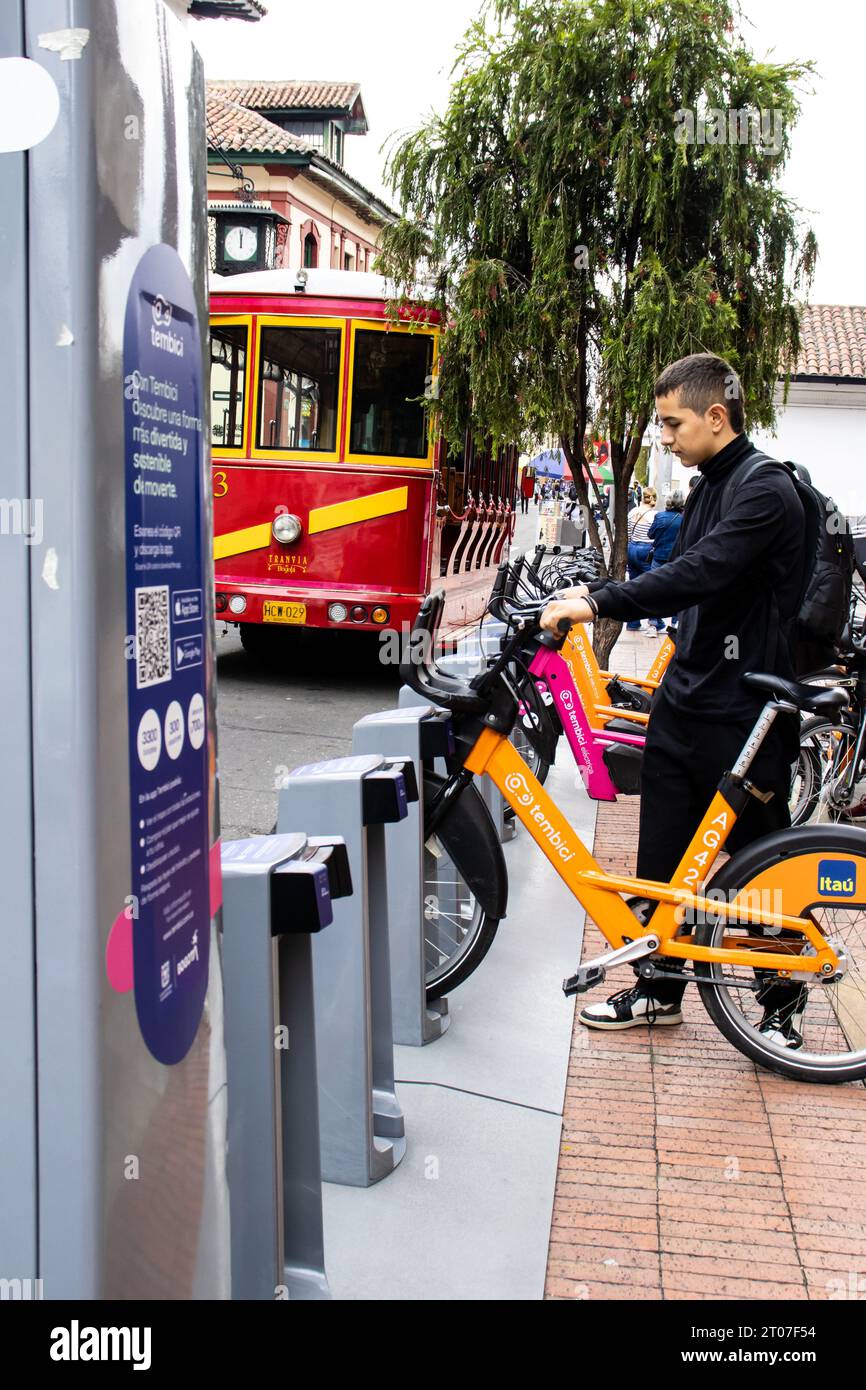 BOGOTA, COLOMBIA - MAY 22nd 2023. Young man using the renting bicycle ...