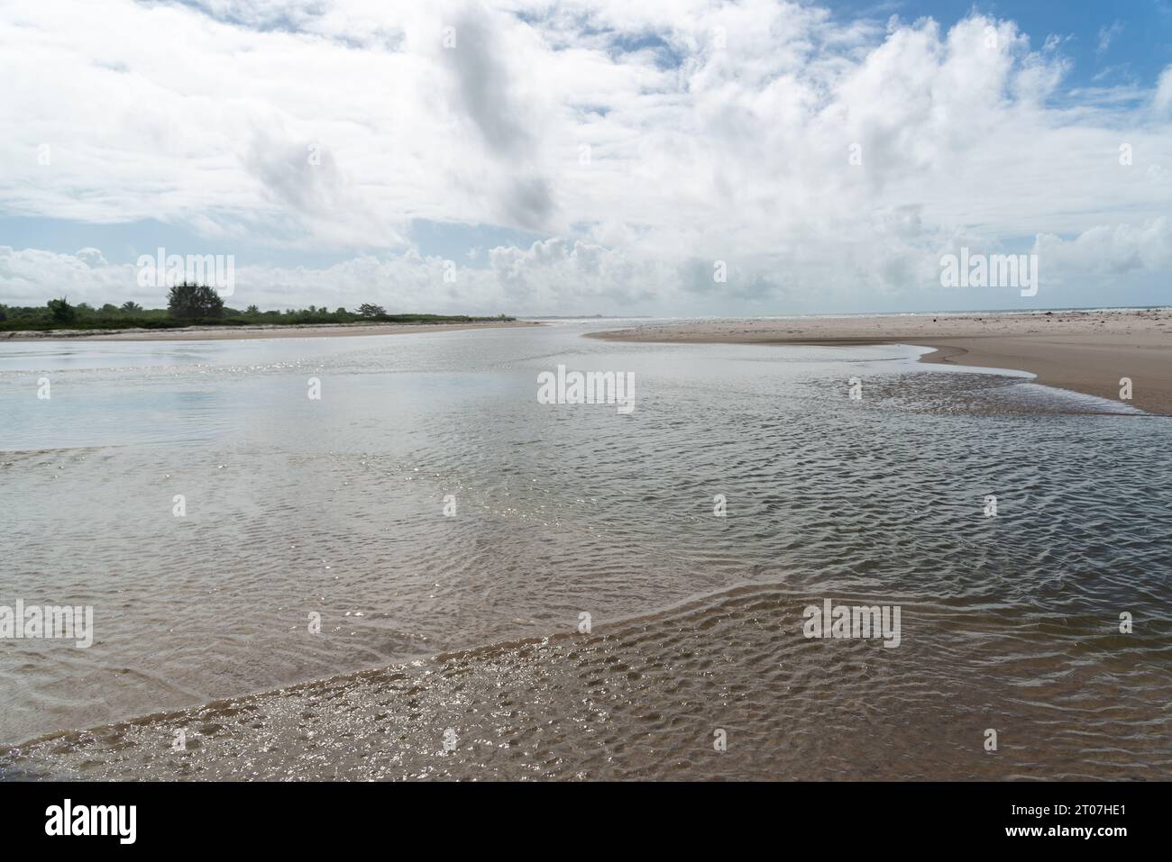 Waters from a river that flows into the sea. white sand on the beach ...