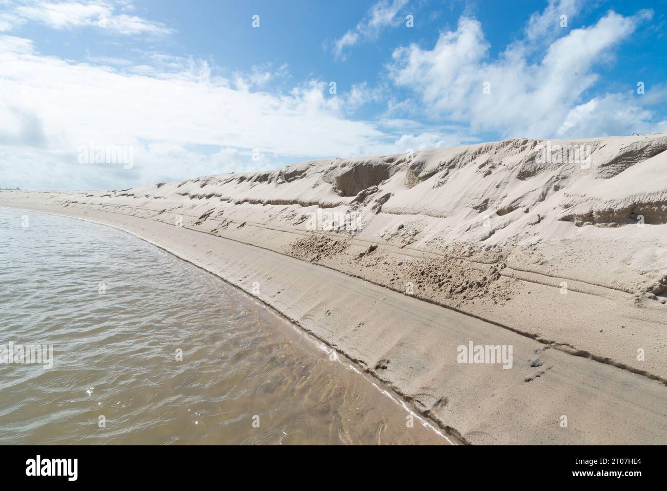 Waters from a river that flows into the sea. white sand on the beach ...