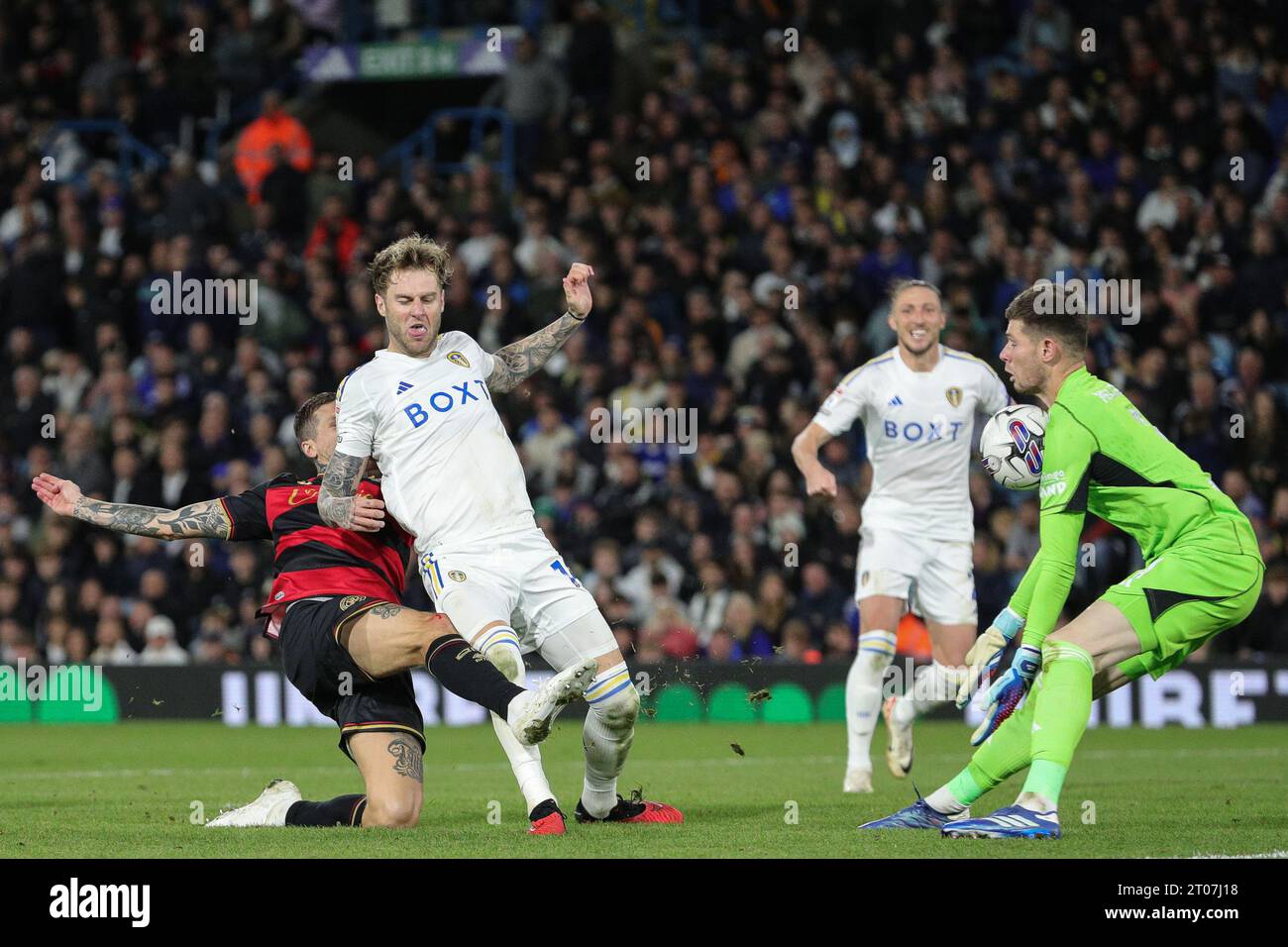 Illan Meslier #1 of Leeds United makes the save from a Lyndon Dykes #9 ...
