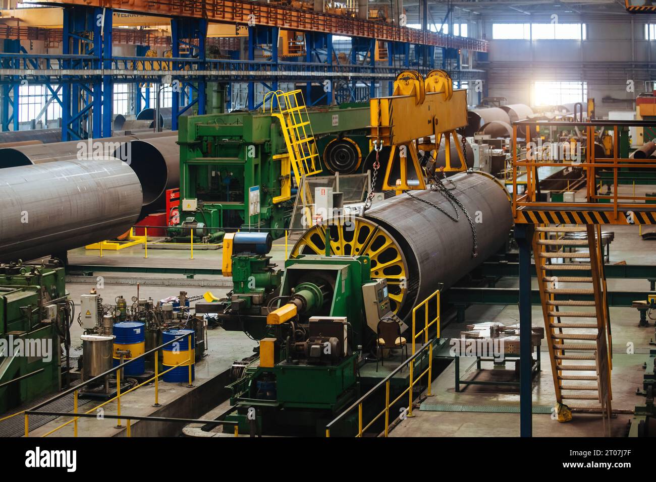 Modern seam pipe factory production line Stock Photo - Alamy