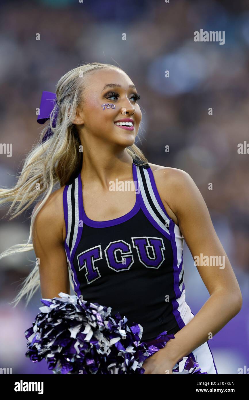 A TCU cheerleader during pregame ceremonies before an NCAA college ...