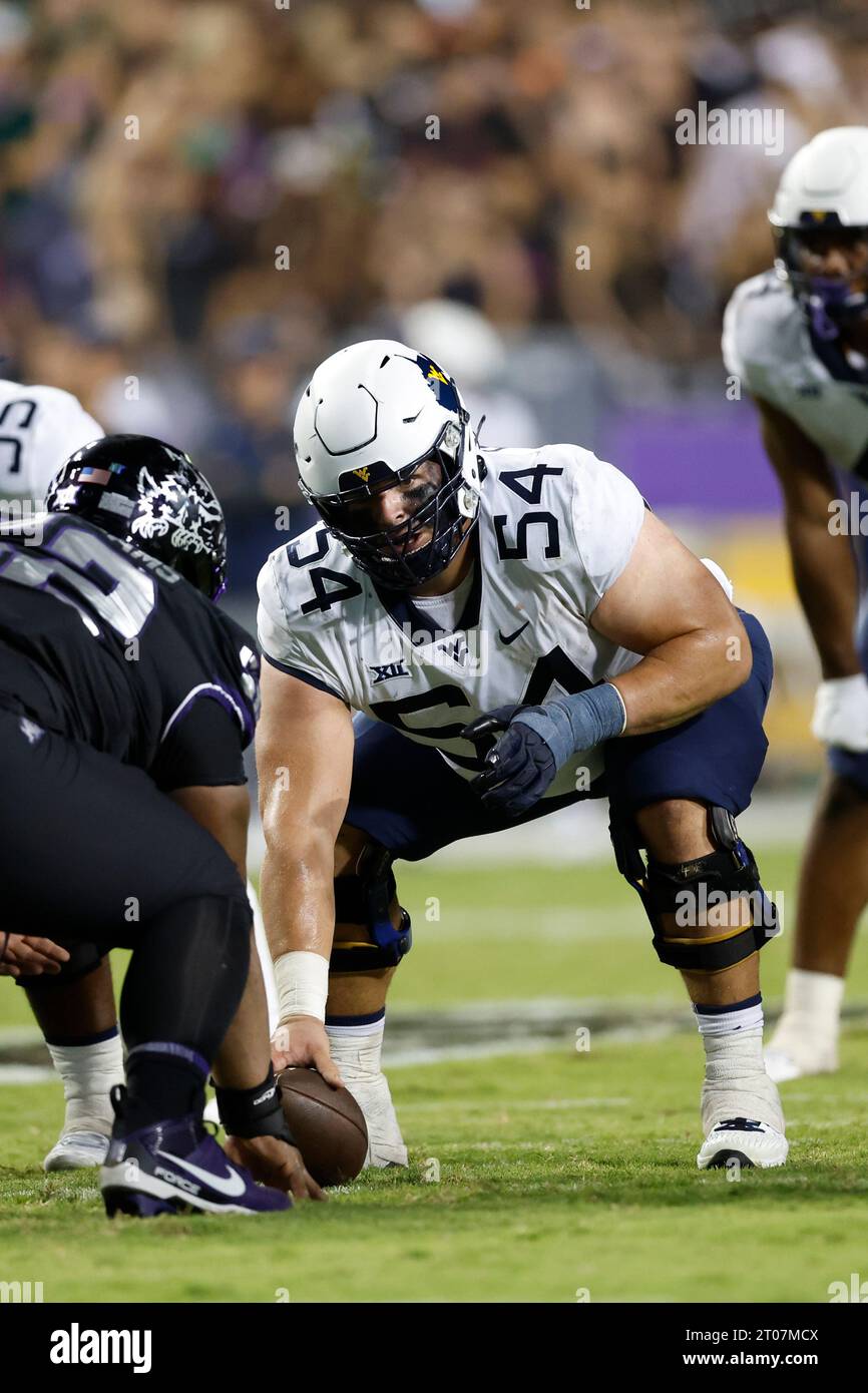 West Virginia offensive lineman, center, Zach Frazier (54) lines up for ...