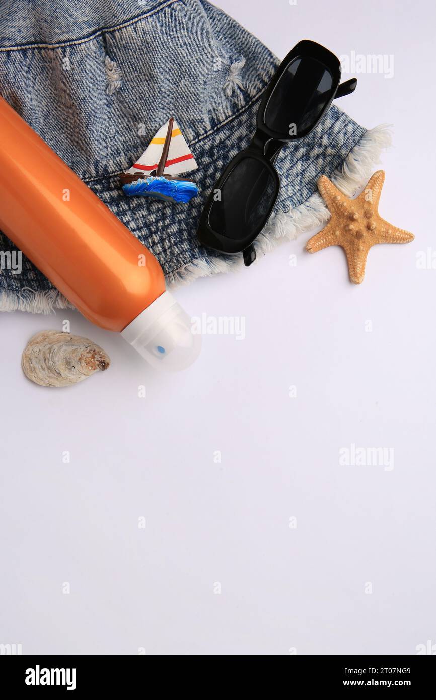 Flat lay composition with bottle of sunscreen on white background ...