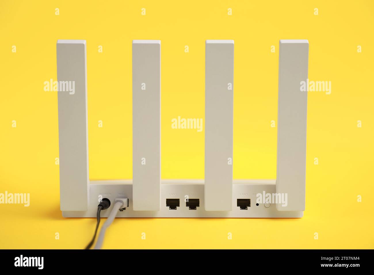 One modern Wi-Fi router on yellow background Stock Photo - Alamy