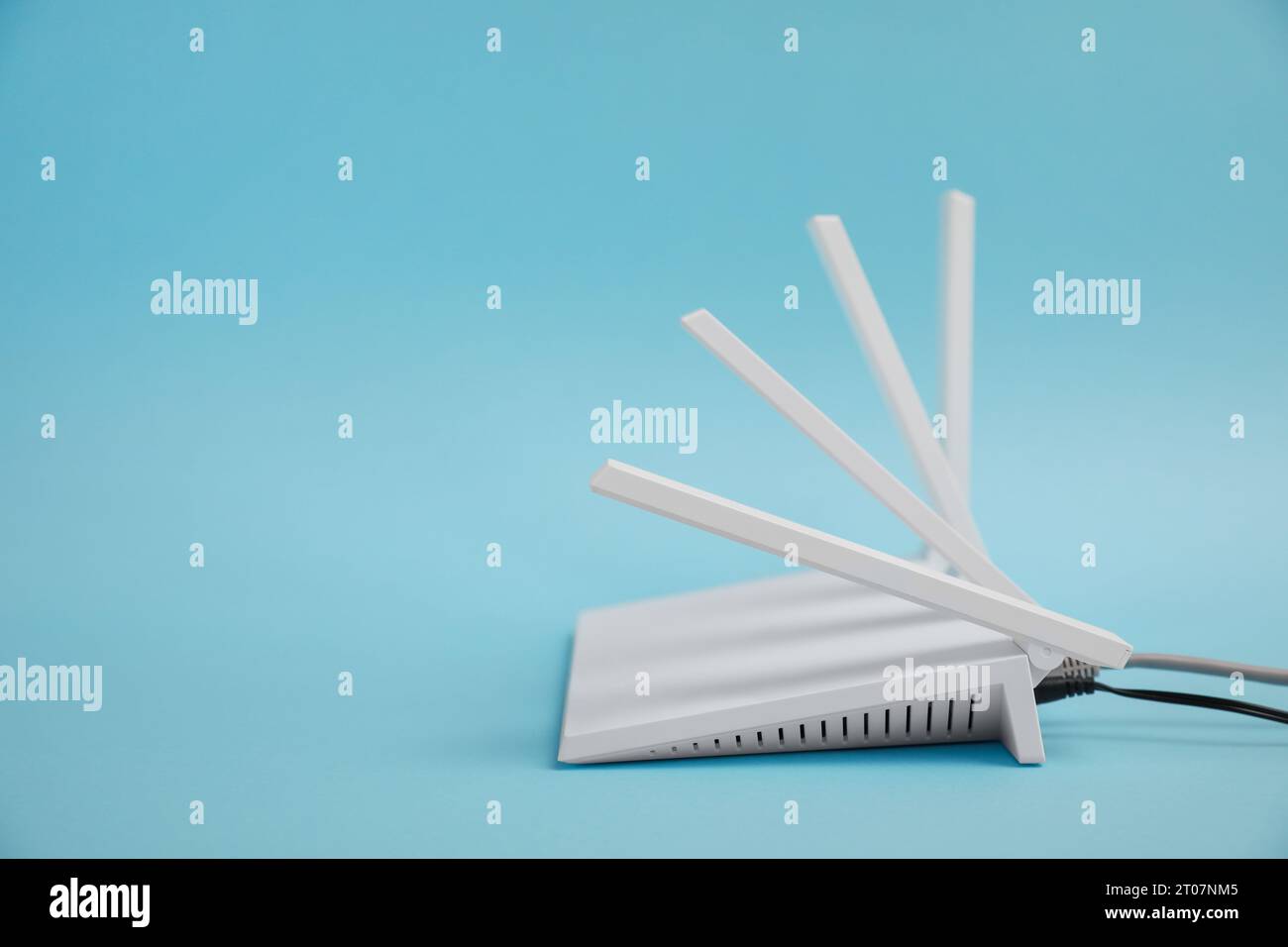 Modern Wi-Fi router on light blue background. Space for text Stock ...