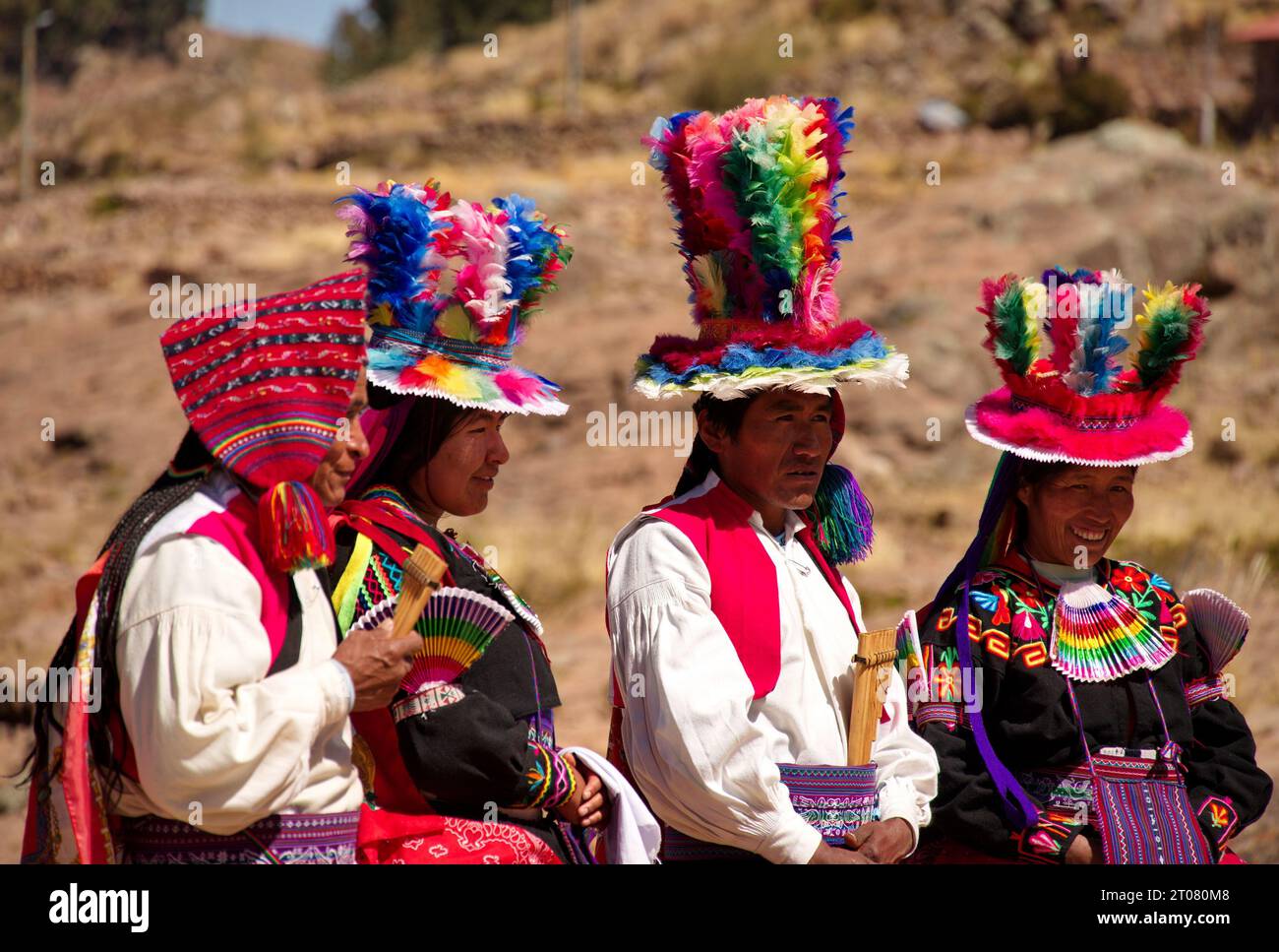Group of Peruvian people in traditional costume on Titicaca island ...
