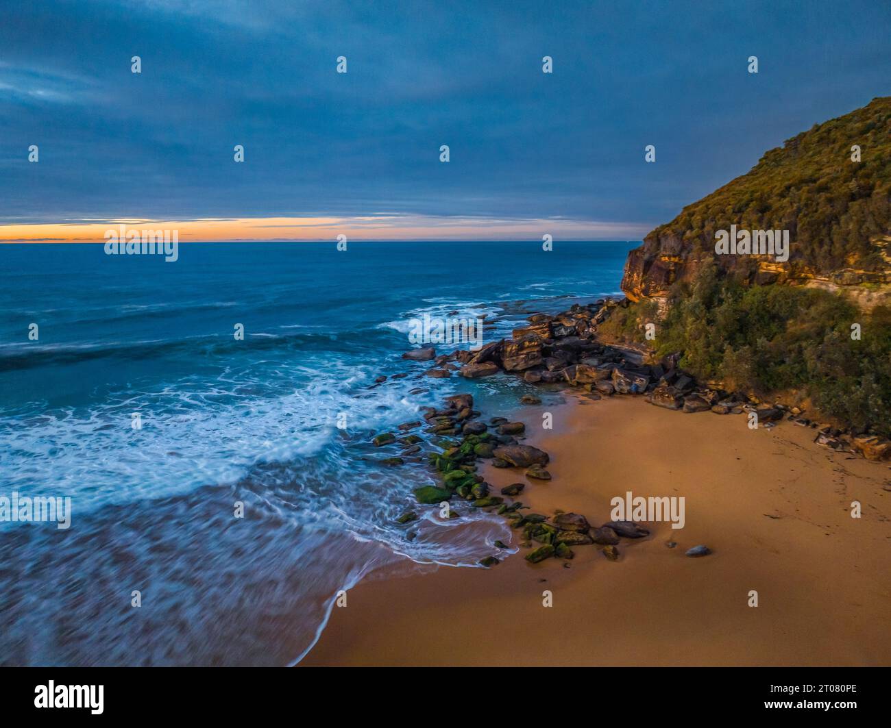 Aerial sunrise seascape with clouds at Killcare Beach on the Central ...