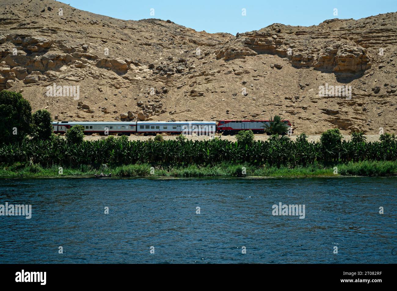 Egyptian train proudly adorned with the national colors meanders along ...