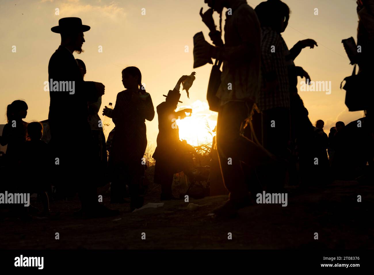FILE - An Ultra-Orthodox Jewish man swings a chicken over his head as ...