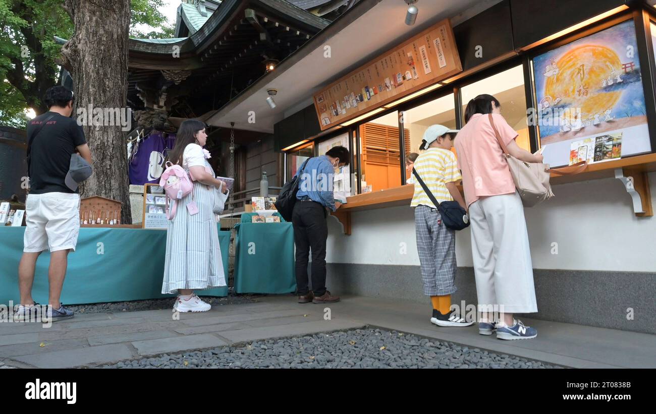 Visitors line up outside a shrine’s office to obtain Goshuin, a seal ...
