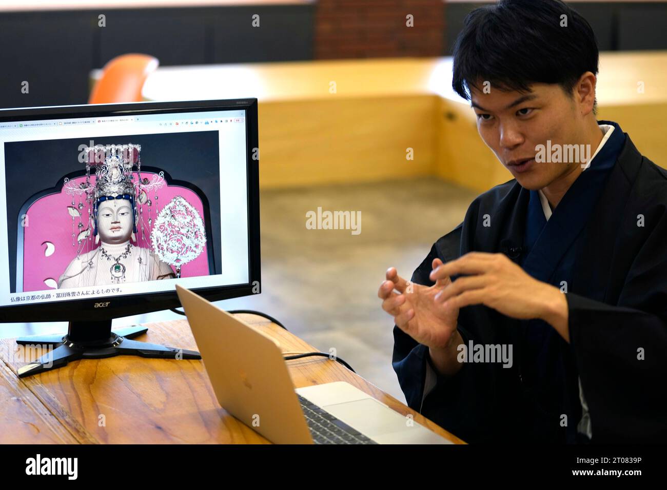 Ryo Yoshida, head of his company, Do The Samurai, speaks during an interview with The Associated ...