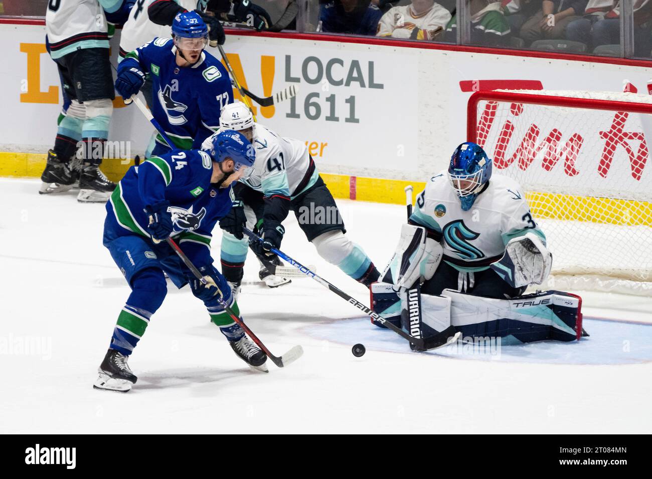 Vancouver Canucks' Pius Suter (24) shoots on Seattle Kraken goaltender ...