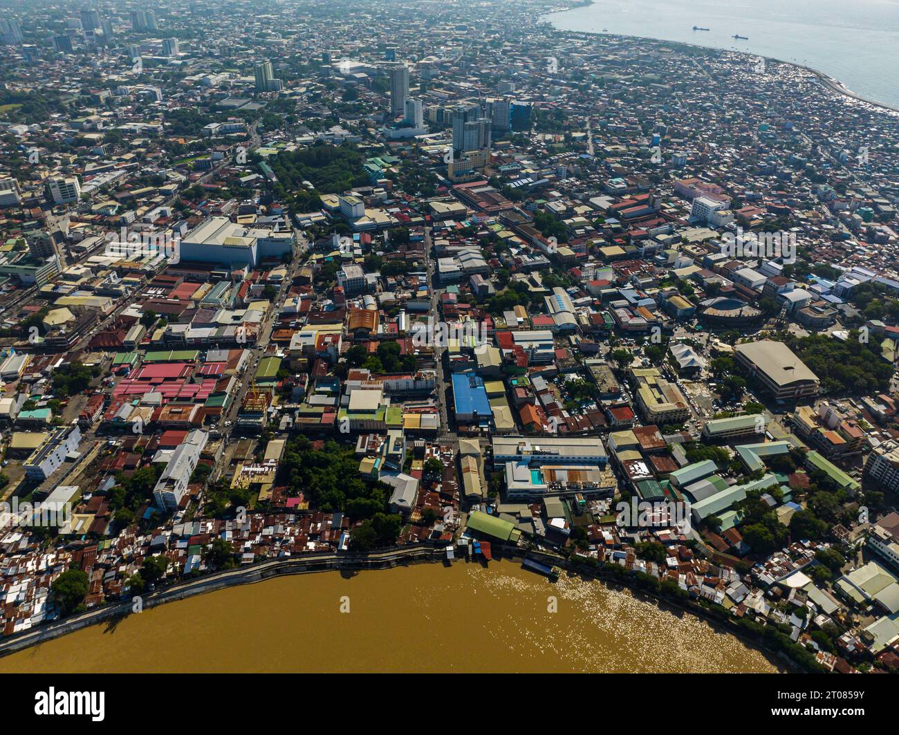 City with river, villages and commercial buildings. Davao City ...