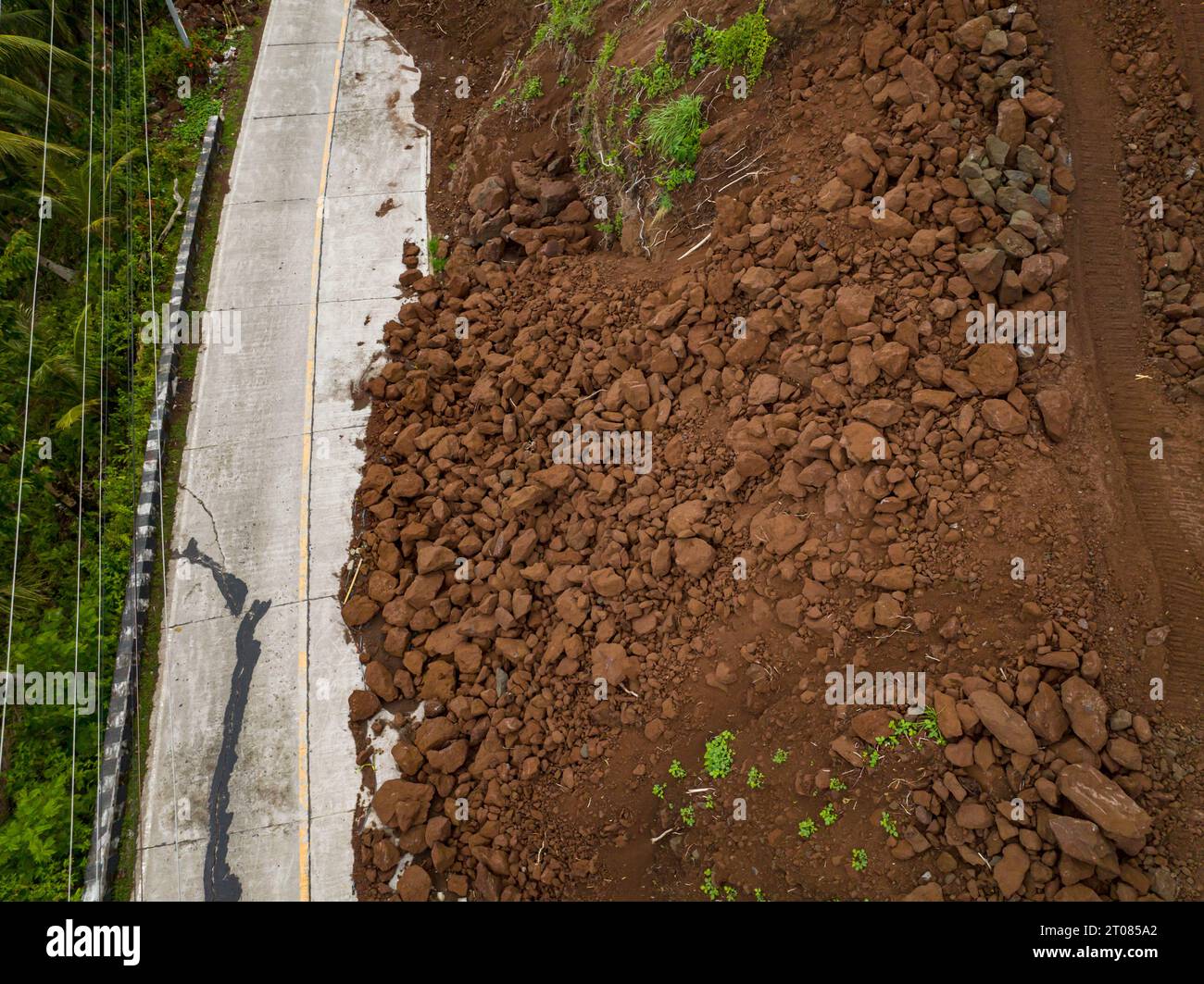 Camiguin Island: Aerial view of mud and rocks blocking the road after ...