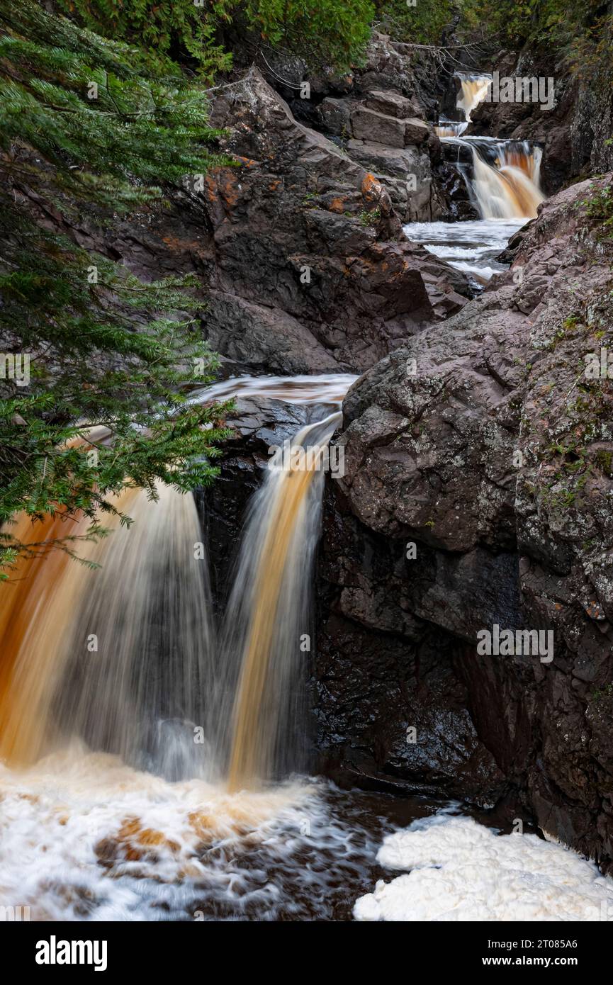 Three waterfalls fall in sucession on the Cascade River in Cascade ...
