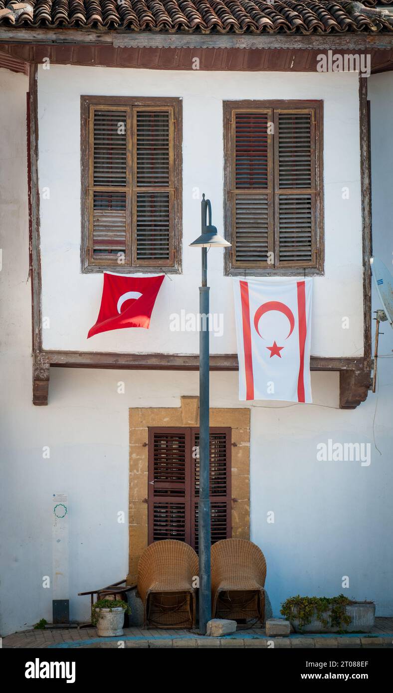 Turkish and Noth Cyprus flags on a traditional old building Stock Photo ...
