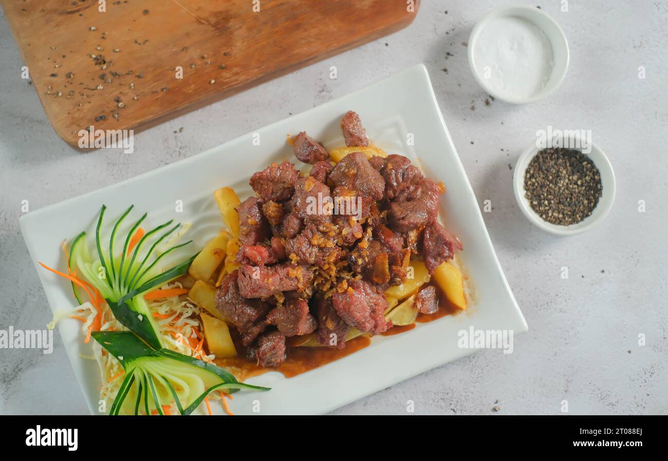 beef chunks steak food presentation Stock Photo - Alamy