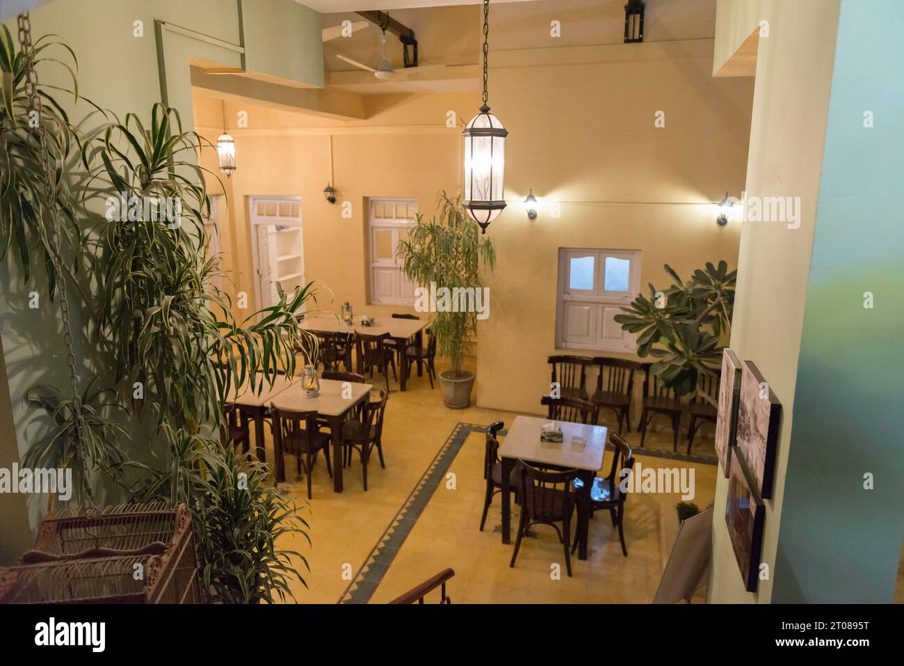 Café in Karachi, offering a warm, inviting ambiance Stock Photo - Alamy