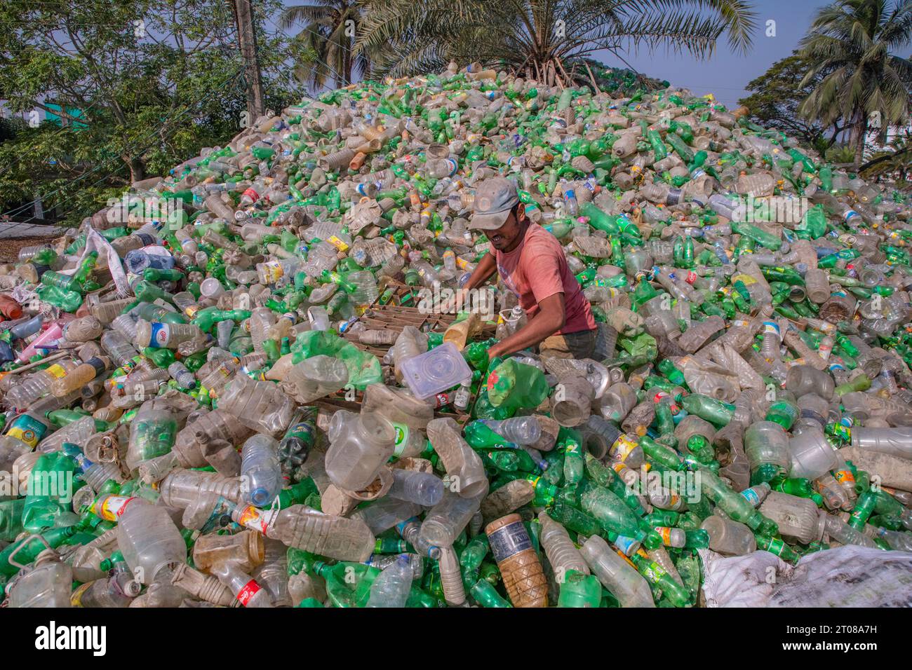 Male children stack plastic bottles hi-res stock photography and images ...