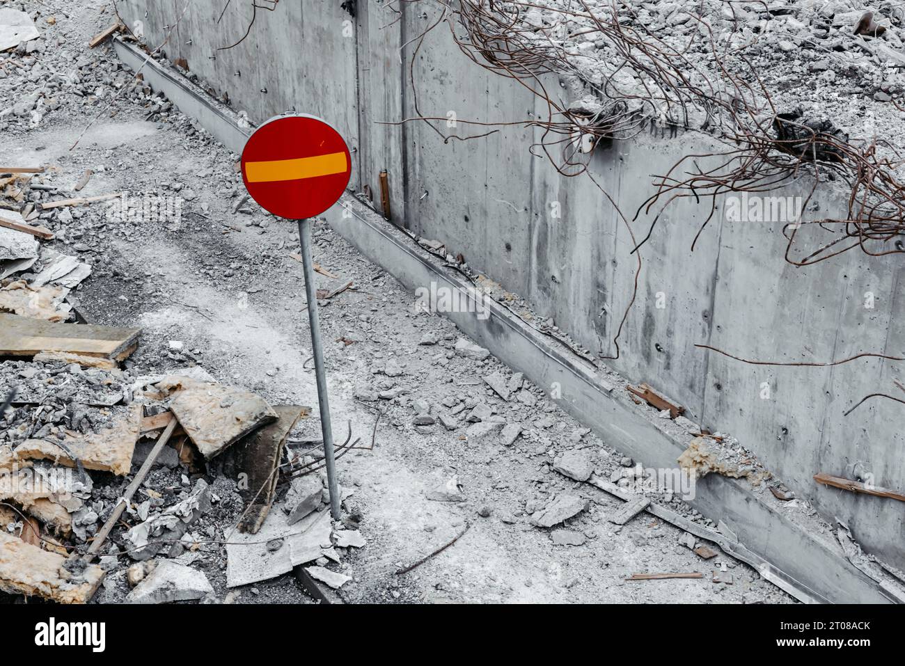 Construction site with one-way road sign and demolition in progress ...
