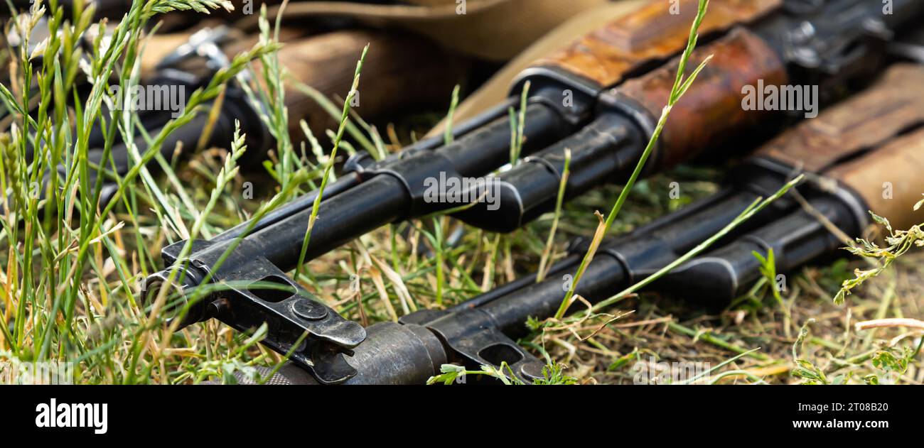 Military machine gun lies on the dry grass in the field Stock Photo - Alamy