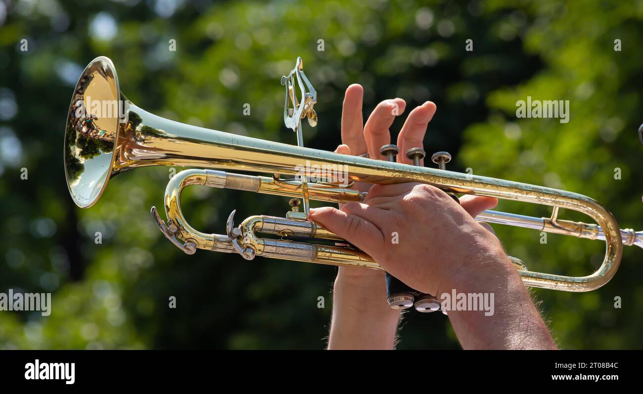 playing a brass instrument. military band performs at the festival ...
