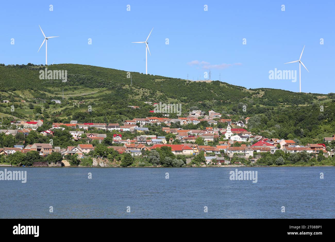 Coronini village & Moldova Noua onshore wind turbines farm on the hill ...