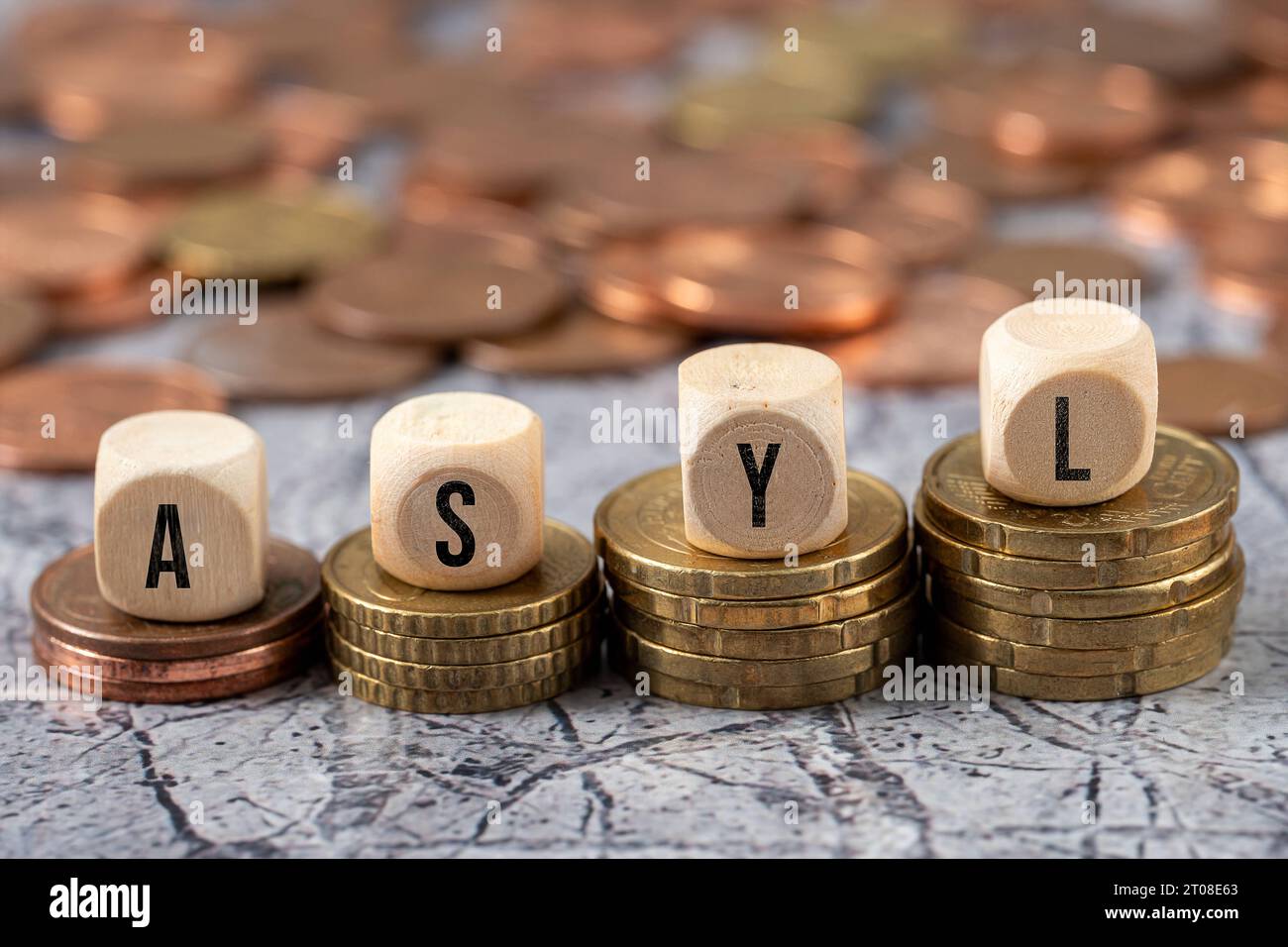 3 October 2023: Wooden cube with writing asylum on euro money coins ...
