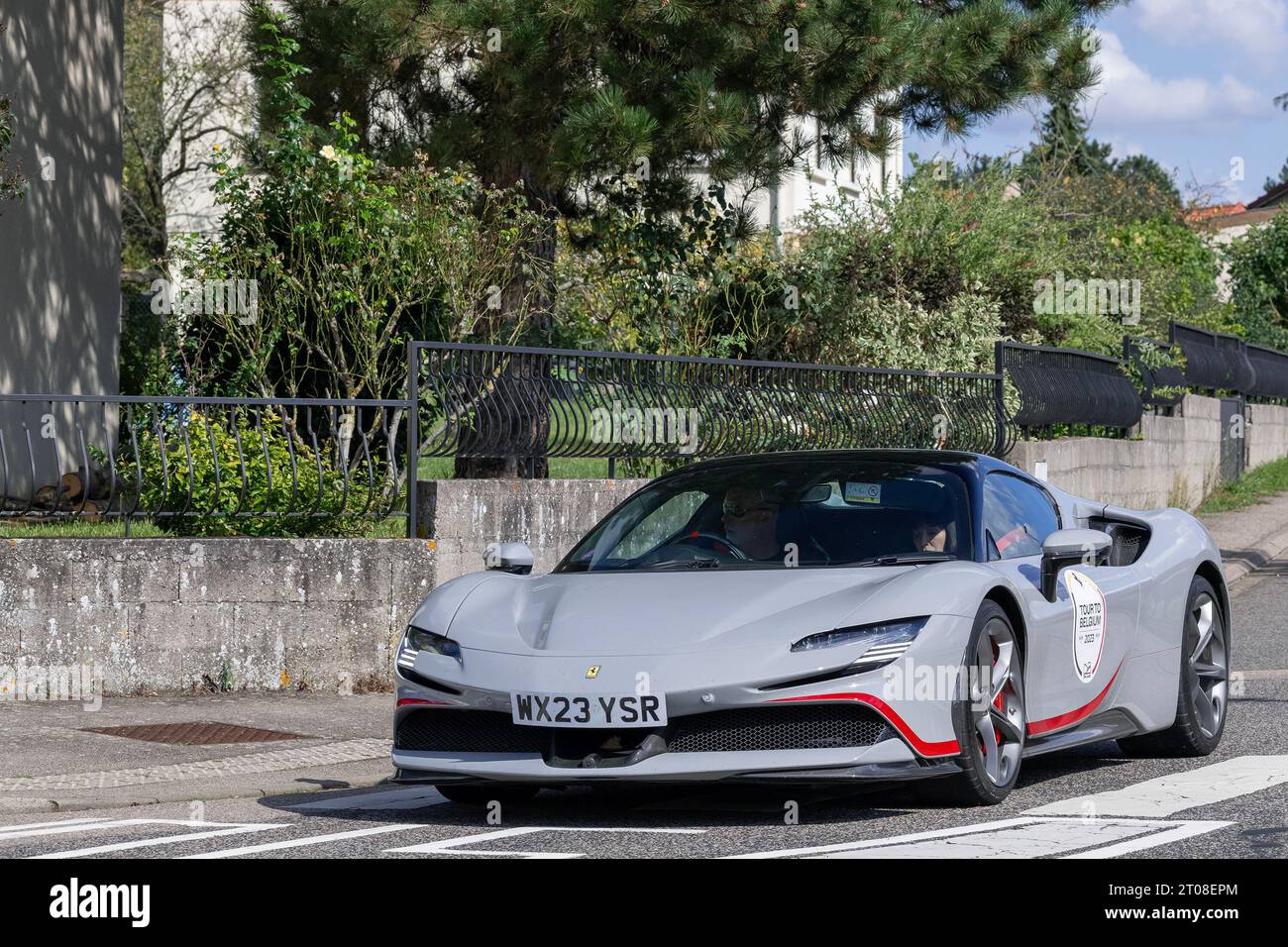 Grey Ferrari SF90 Spider driving on the road Stock Photo - Alamy