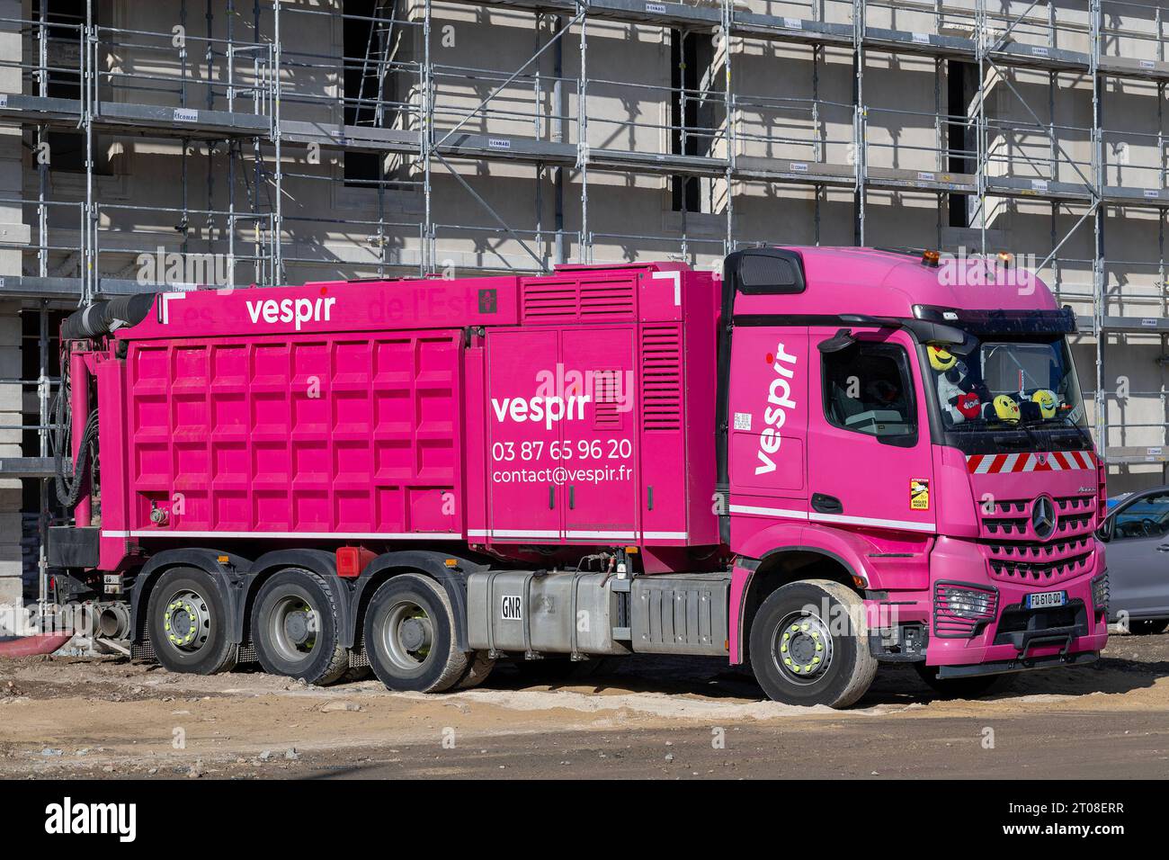 Pink suction excavator truck Mercedes-Benz Arocs on construction site ...