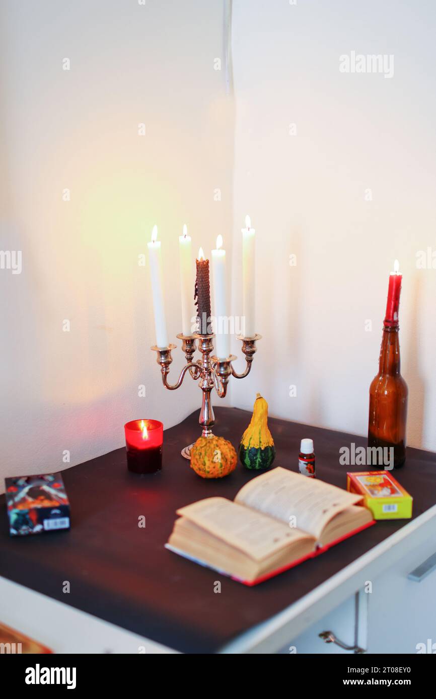 Magic attributes of modern witch on table Stock Photo - Alamy
