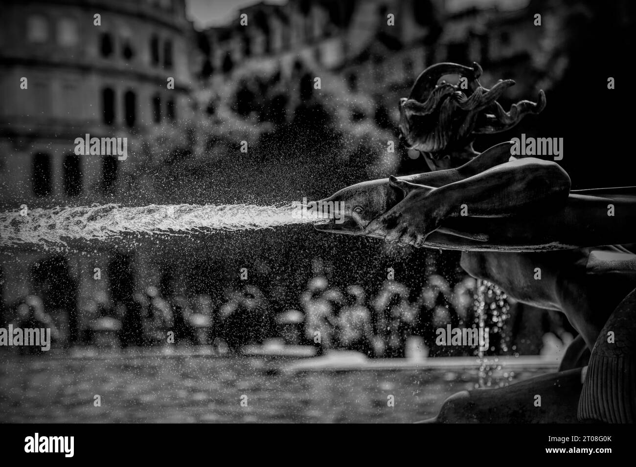 A closeup of a fountain spraying water in grayscale Stock Photo - Alamy