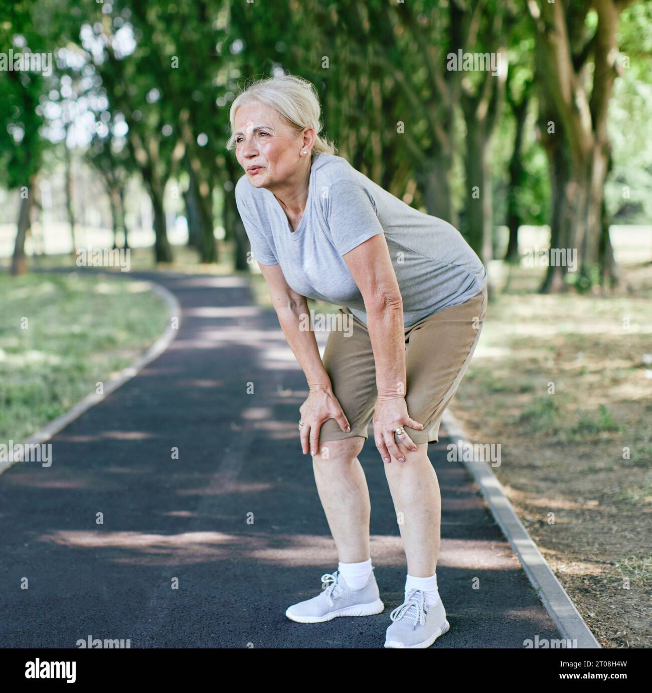 outdoor senior fitness jogging woman active sport exercise tired ...