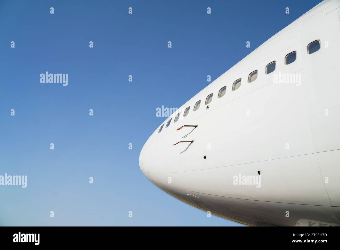 A Boeing 747-400 jumbo jet against a blue sky on a runway in Kemble ...