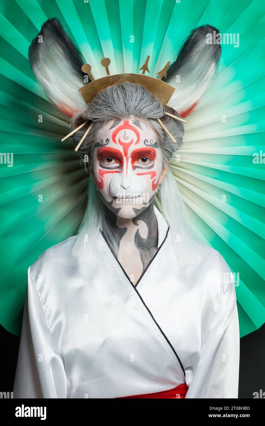 Perfect model woman asian hare on green background. Halloween makeup ...