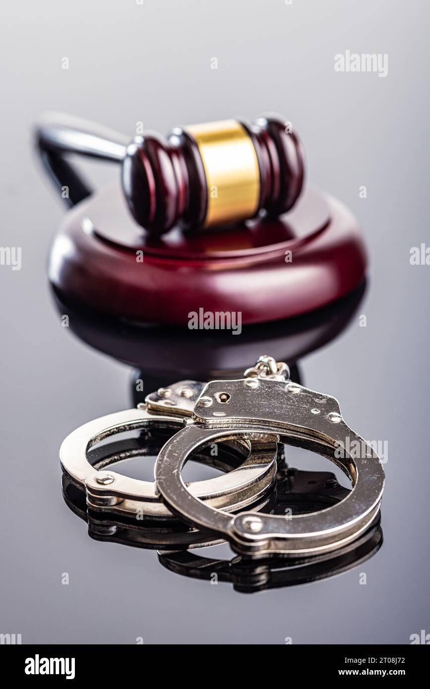 Mallet handcuffs on table hi-res stock photography and images - Alamy